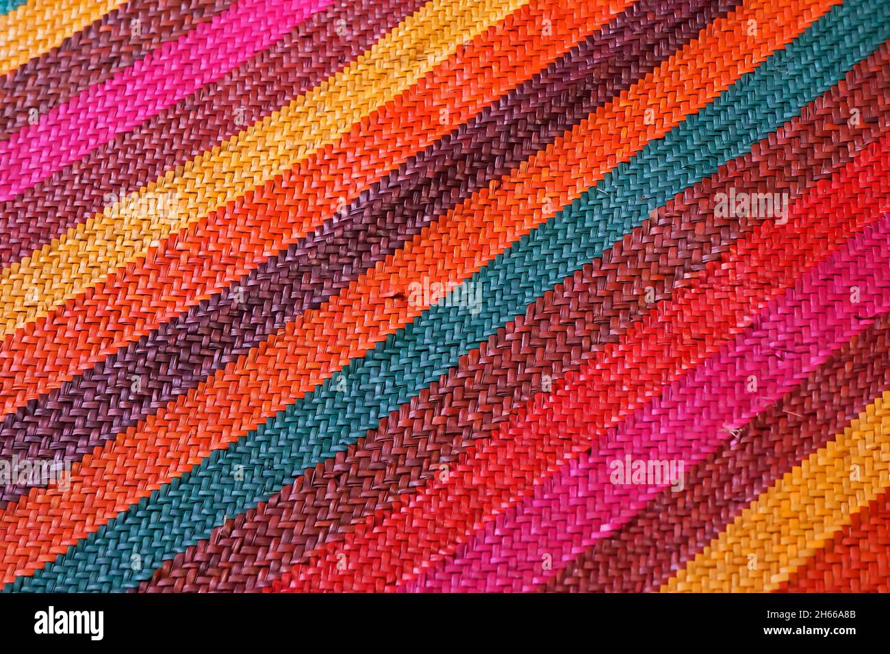 Handicraft with colorful striped straw Stock Photo - Alamy