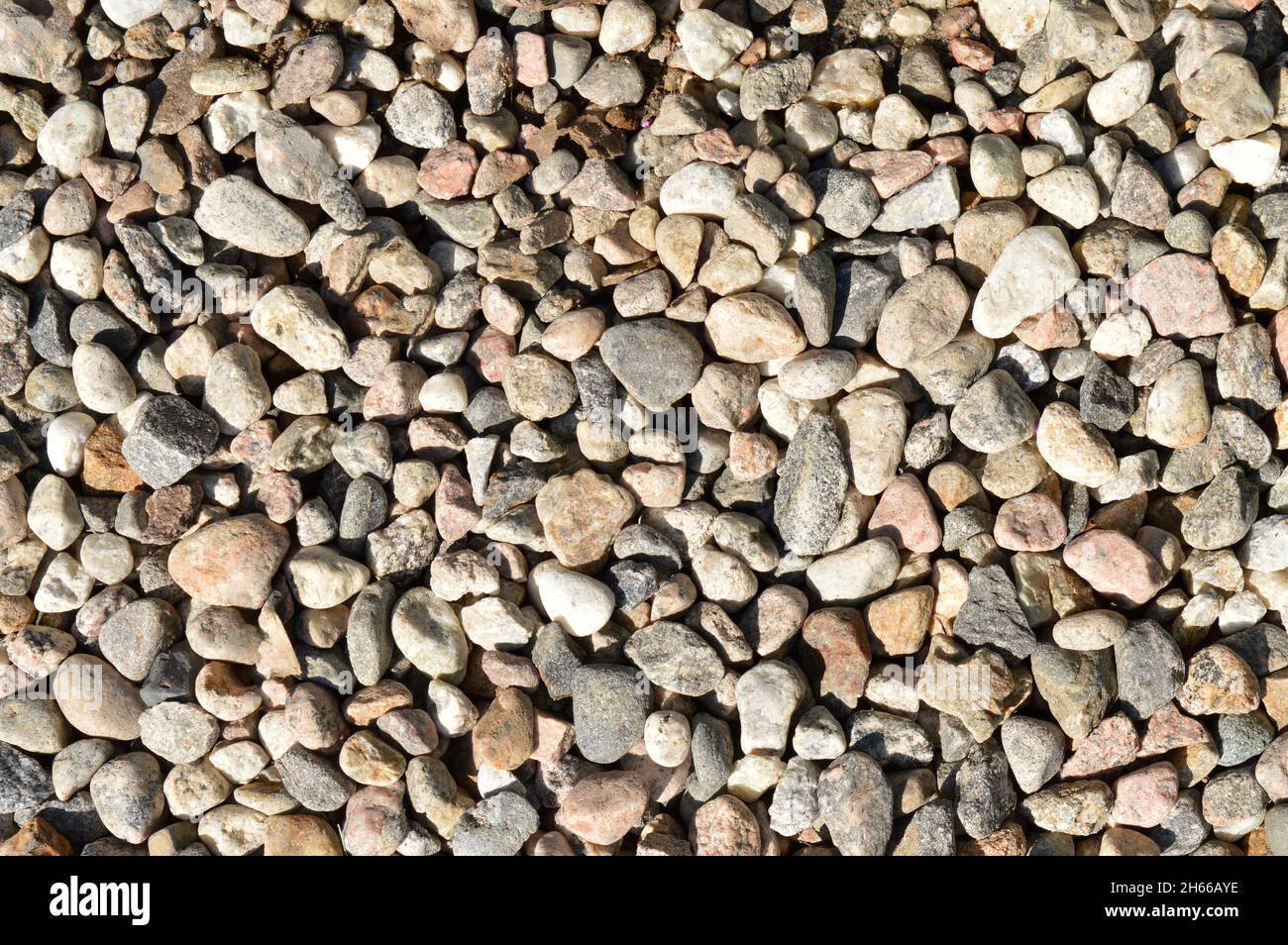 river rocks at a beach worn away by centuries of erosion Stock Photo ...