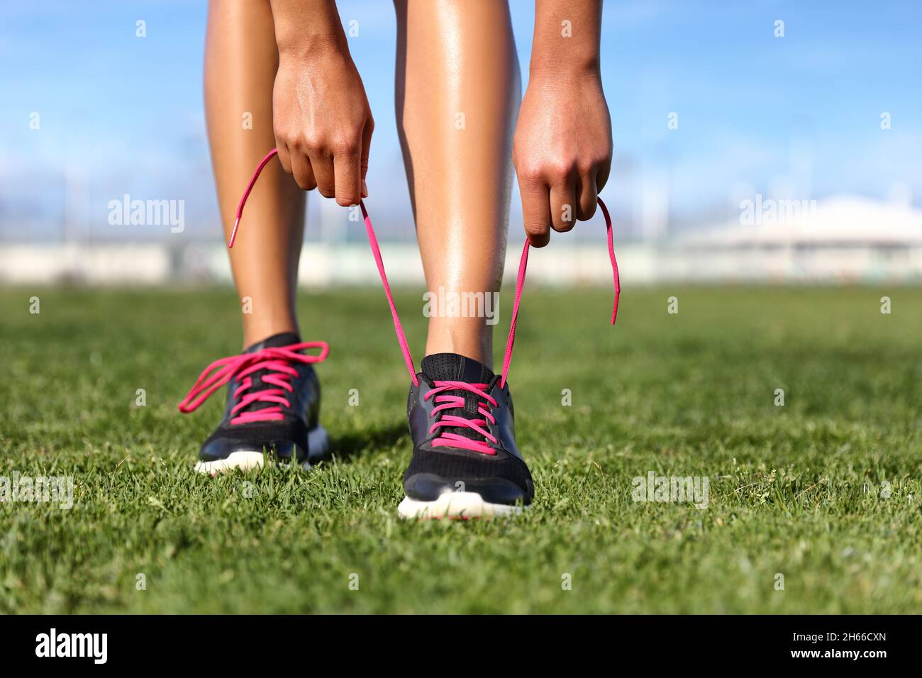 Running and fitness exercise sport girl getting ready tying shoes ...