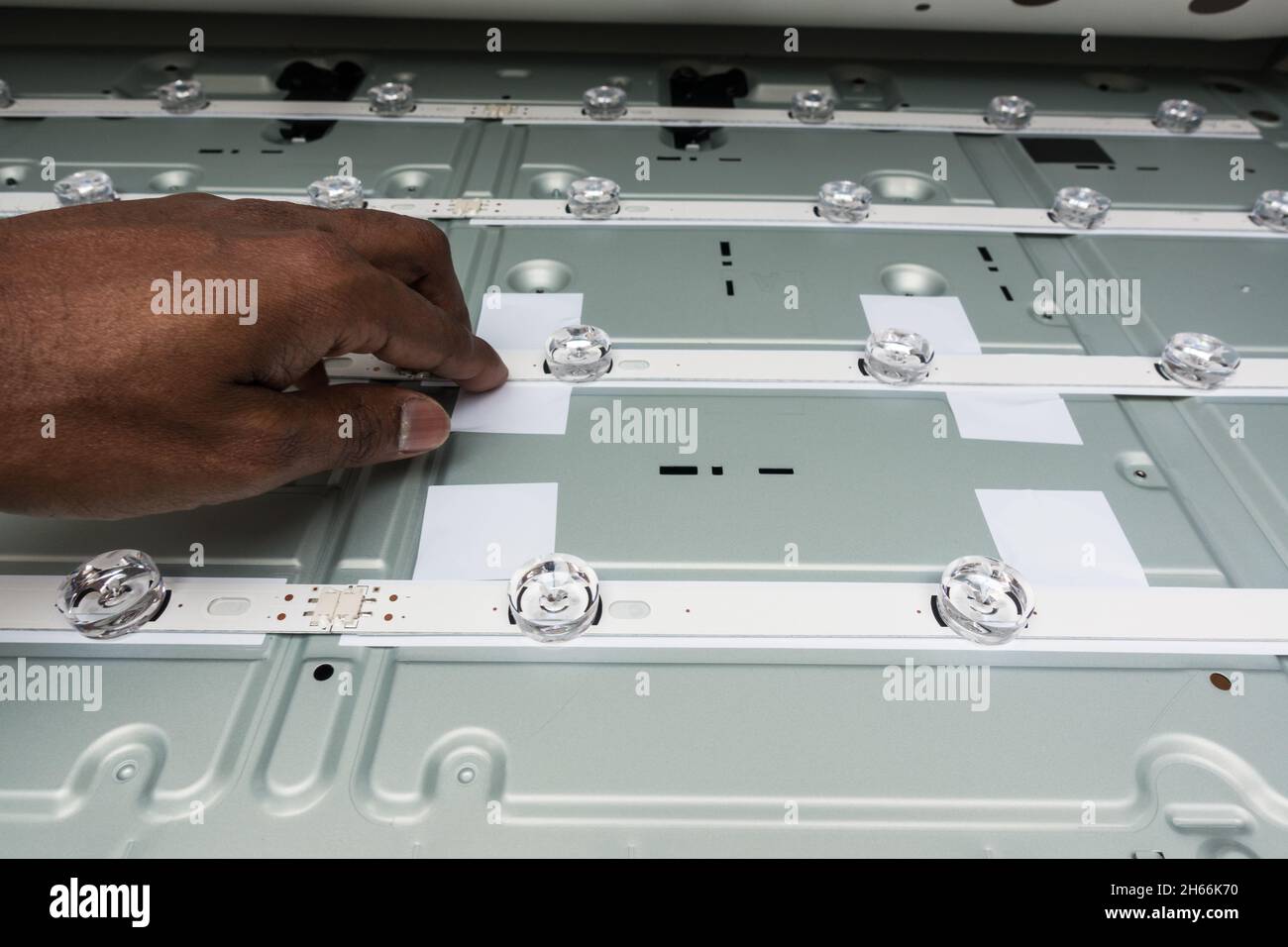 Fixing broken LED lights of a LCD display Television screen Stock Photo ...