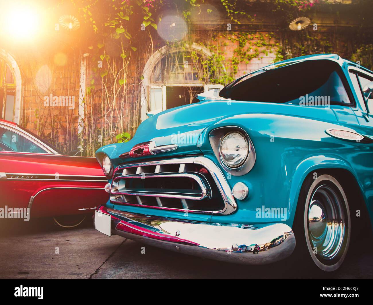 Blue vintage classic car in a colorful street of old town. Travel and ...