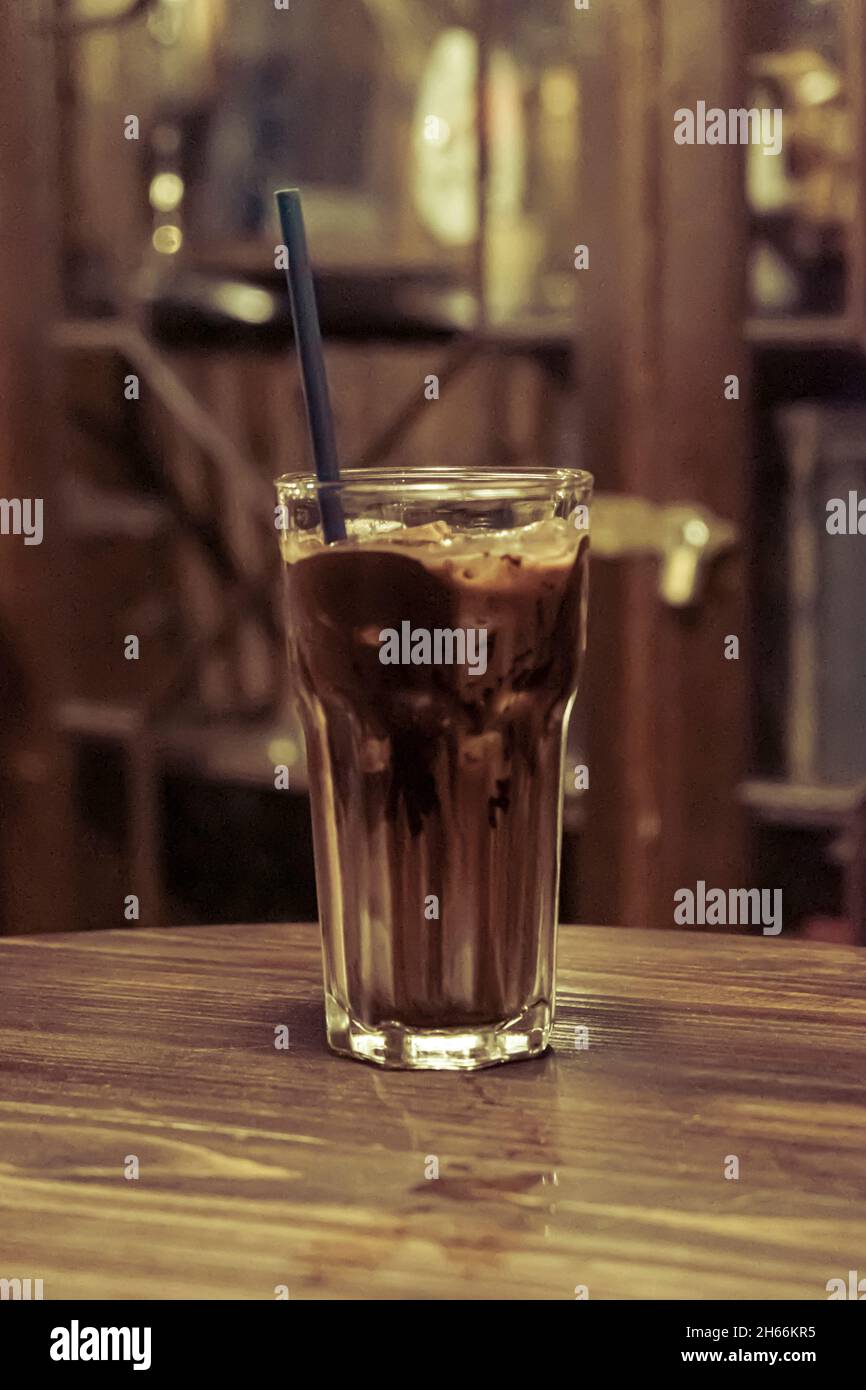 iced latte cocoa chocolate in a tall glass. cold summer drink ...