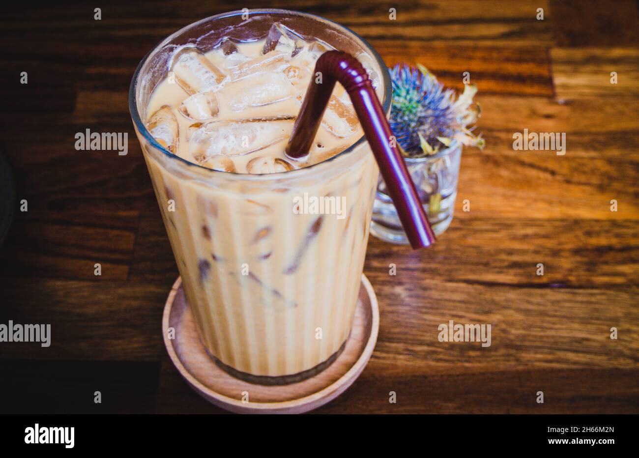 iced latte coffee in a glass with cream on bottom . cold summer drink ...