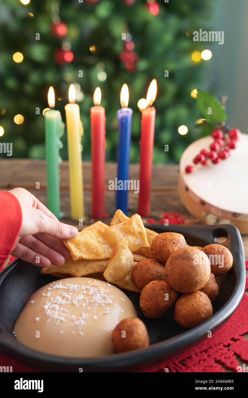 Candlelight Day. Typical Colombian food. Buñuelo, custard and flakes ...