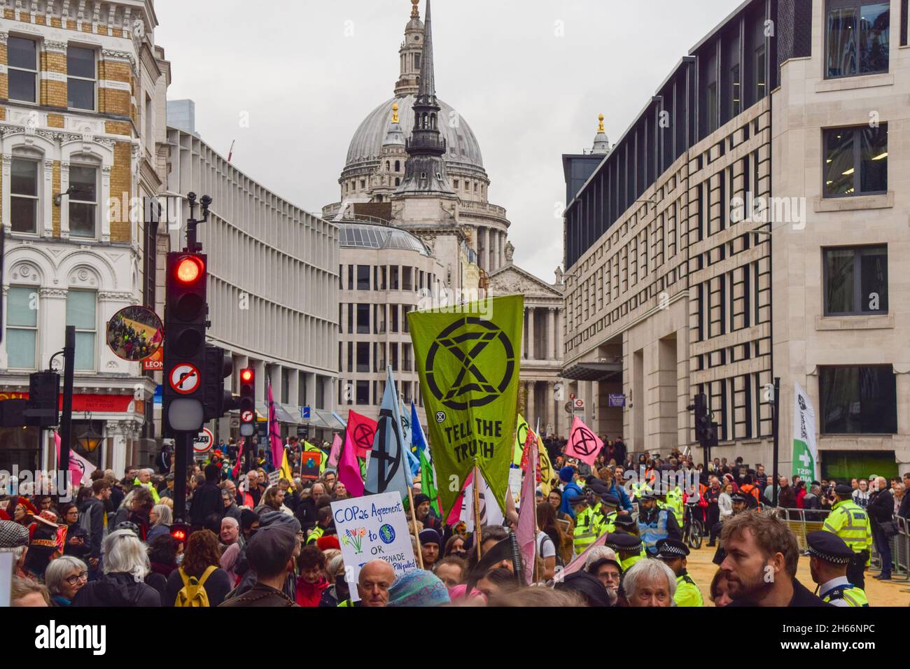 London, UK. 13th Nov, 2021. Demonstrators march with Extinction ...