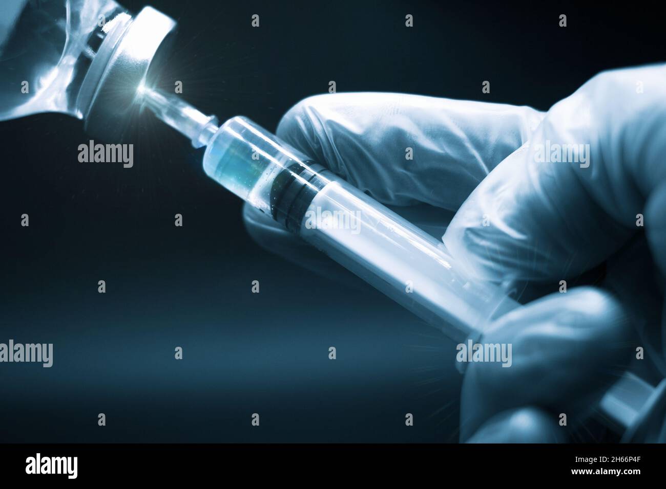 Pharmaceutical scientist holding syringe injecting hi-res stock ...
