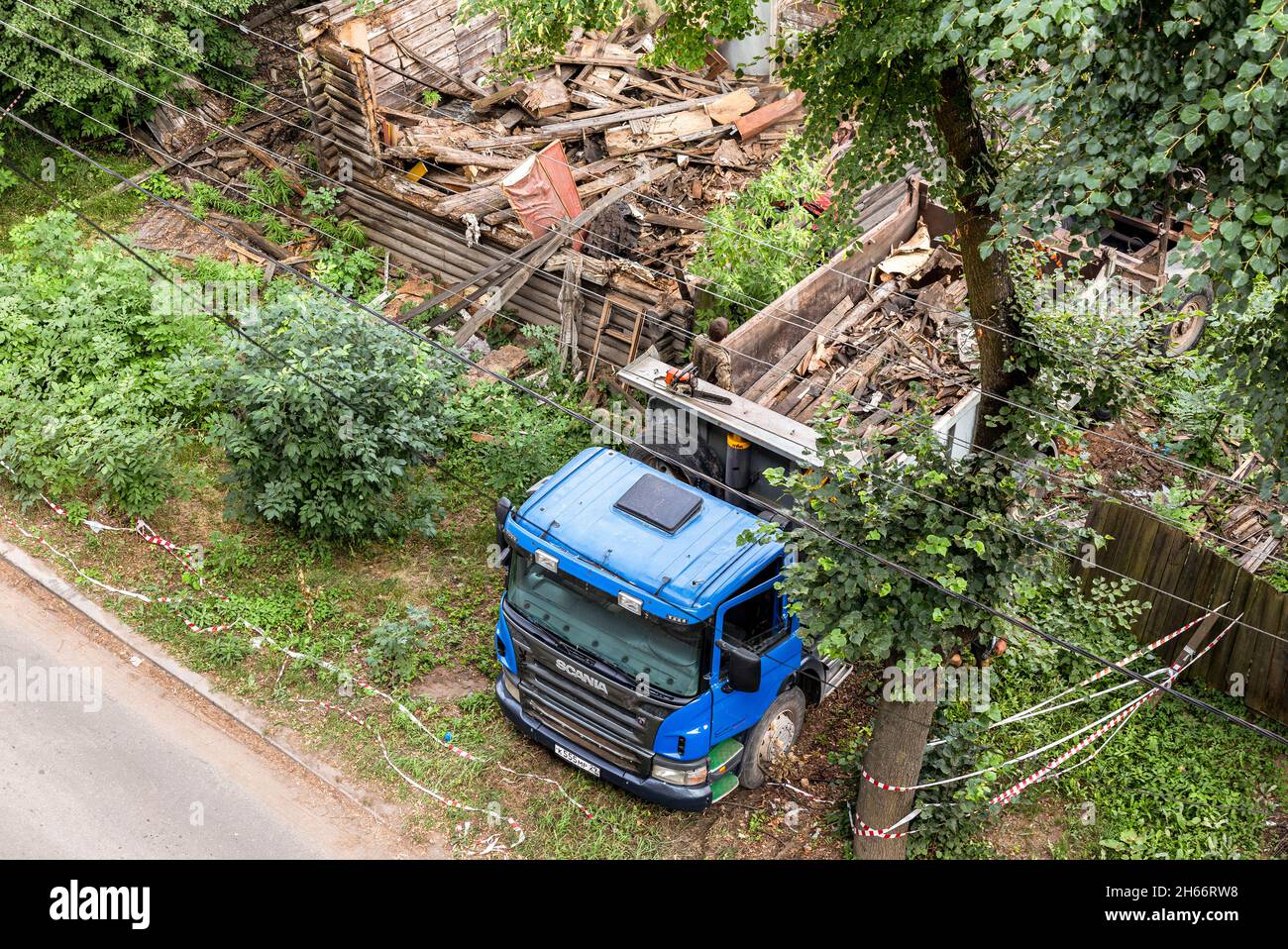Novgorod, Russia - July 2, 2021: Demolition of an old wooden house ...