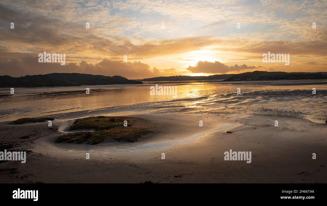 Low angle capture of a tranquil beach scene at sunset, located in ...