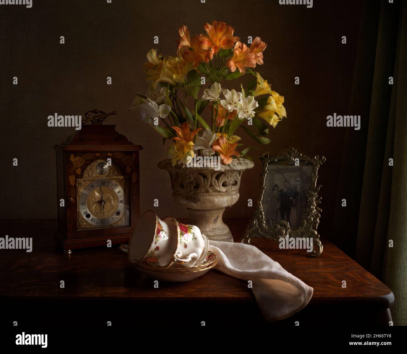 This image features a vintage still-life arrangement, evoking a sense ...