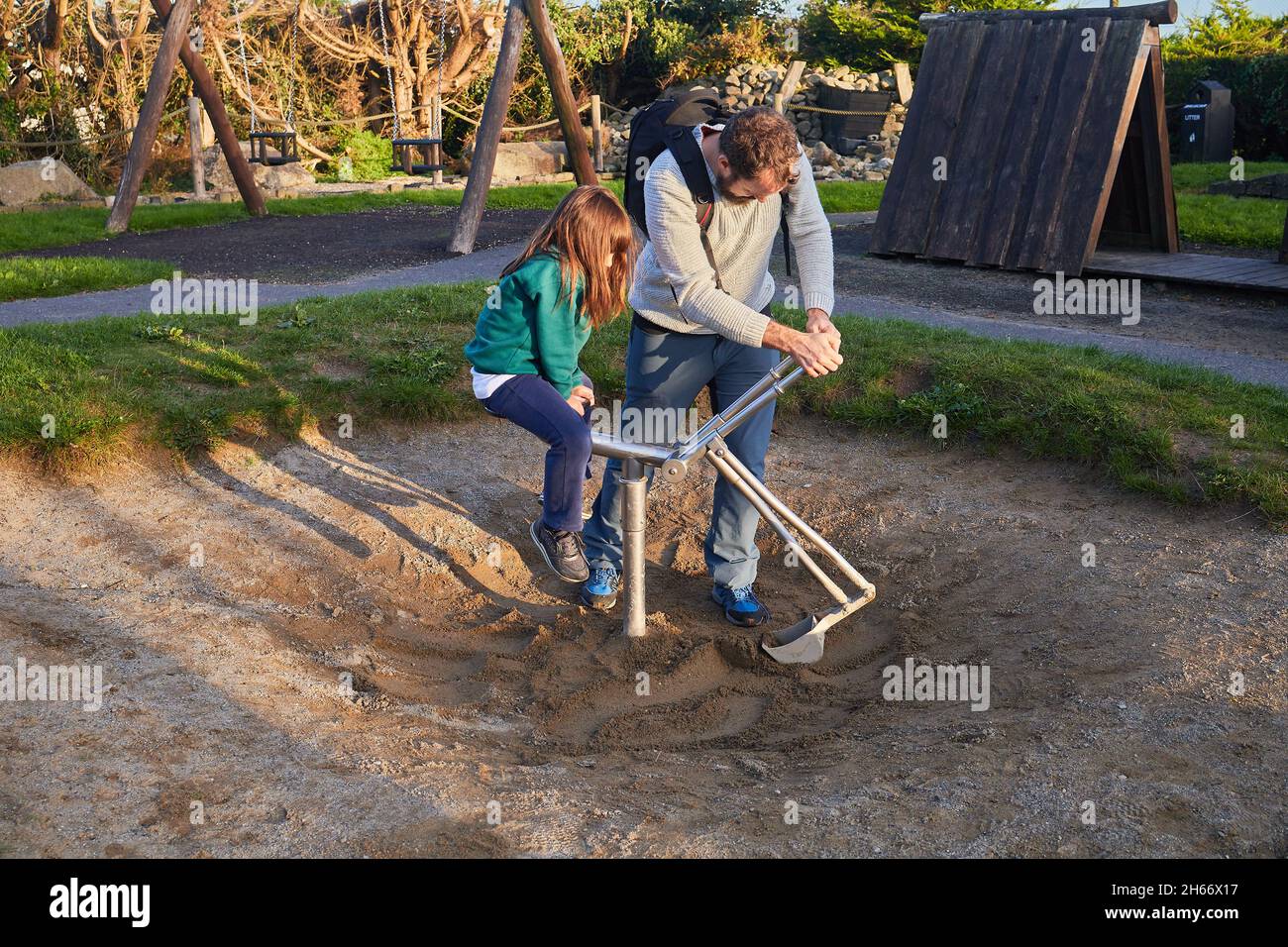 Caucasian father and daughter in school uniform playing with a ...