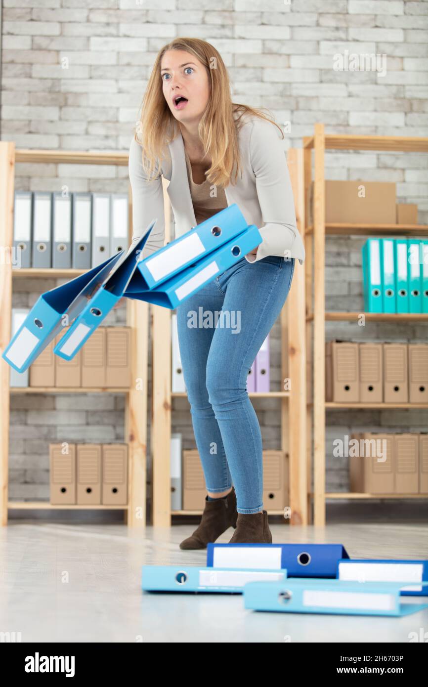 Woman dropping folders hi-res stock photography and images - Alamy Woman dropping folders hi-res stock photography and images - Alamy