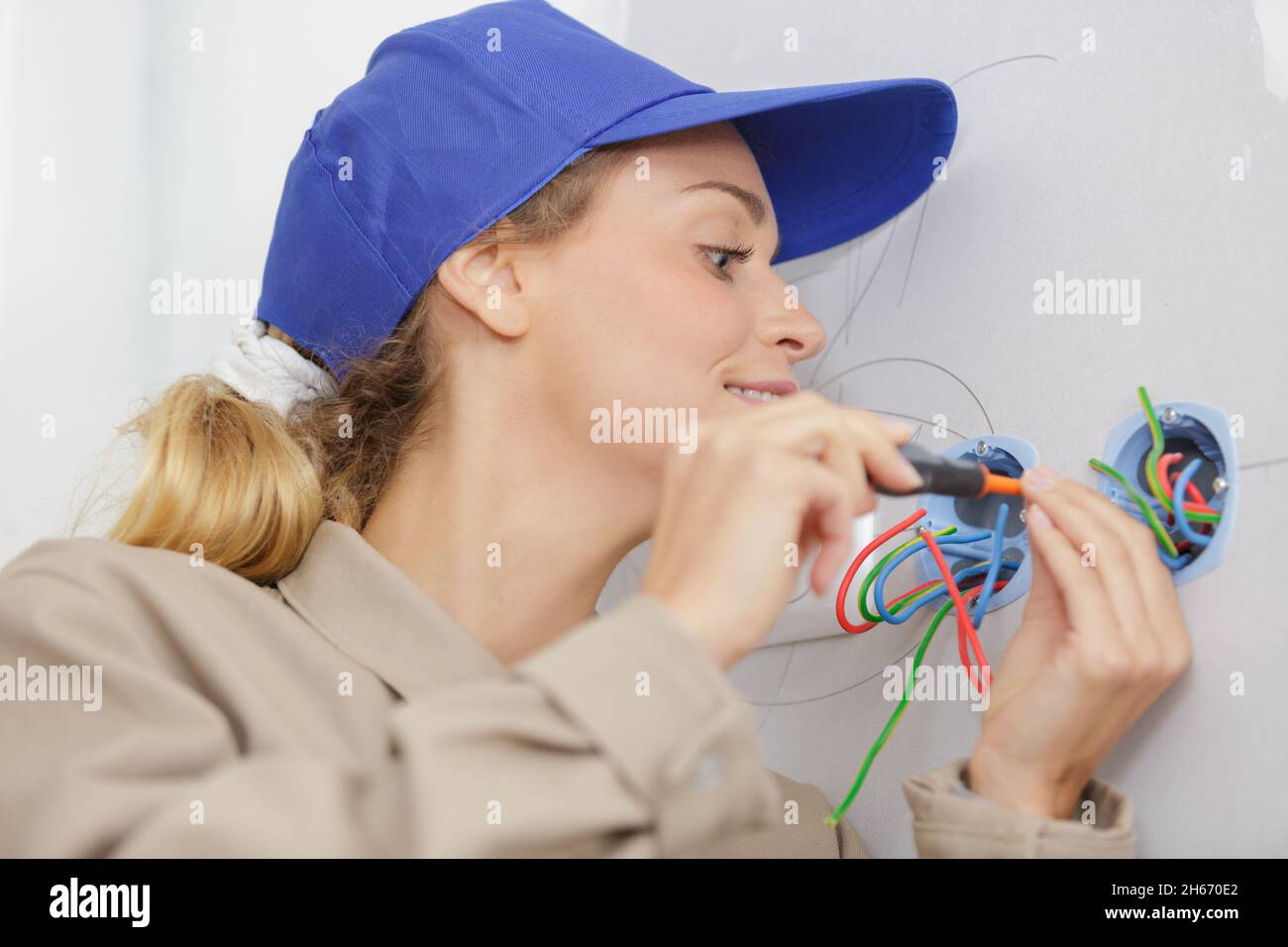female electrician working on wiring installation Stock Photo - Alamy