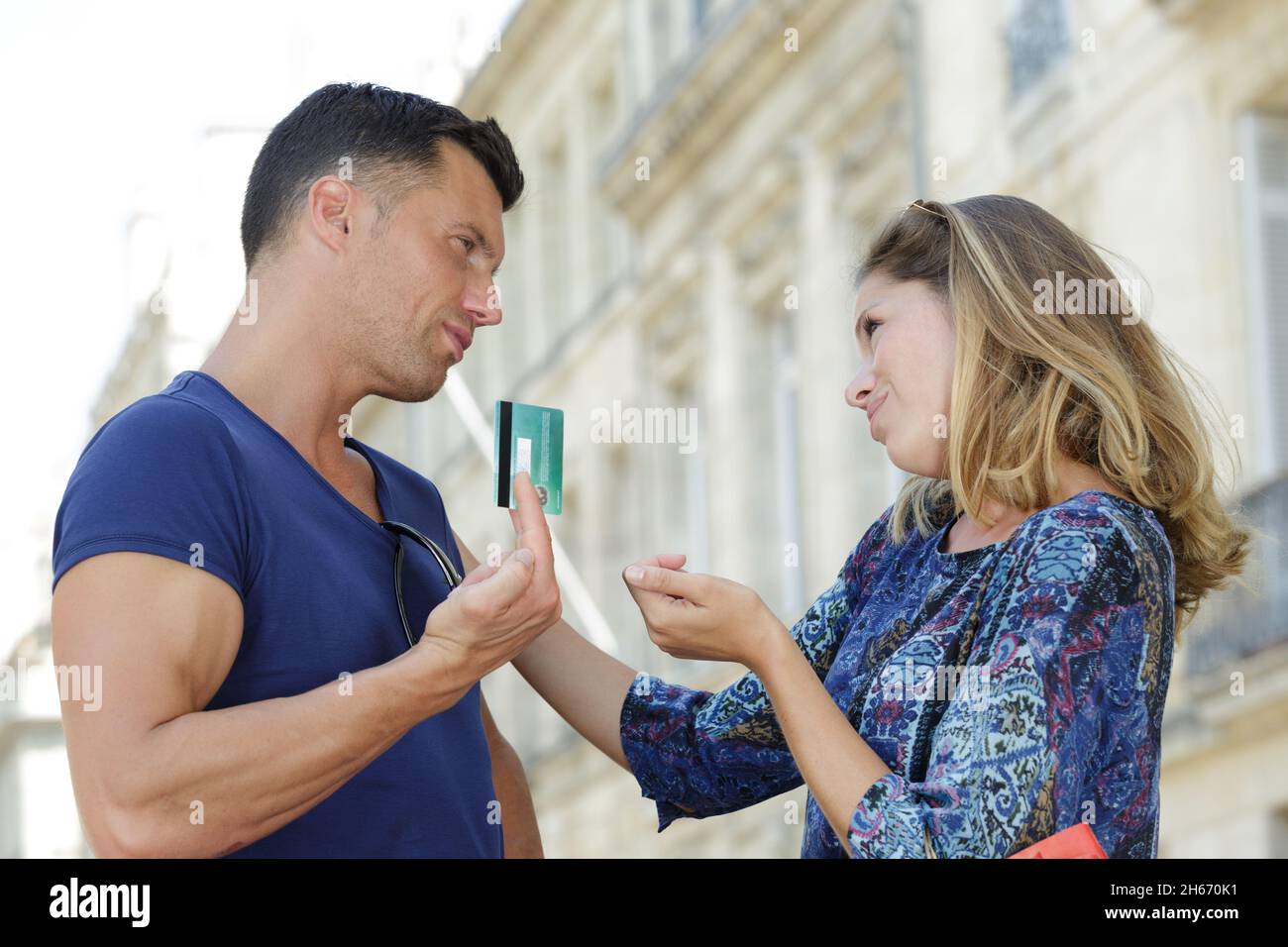 woman begging boyfriend for credit card Stock Photo - Alamy