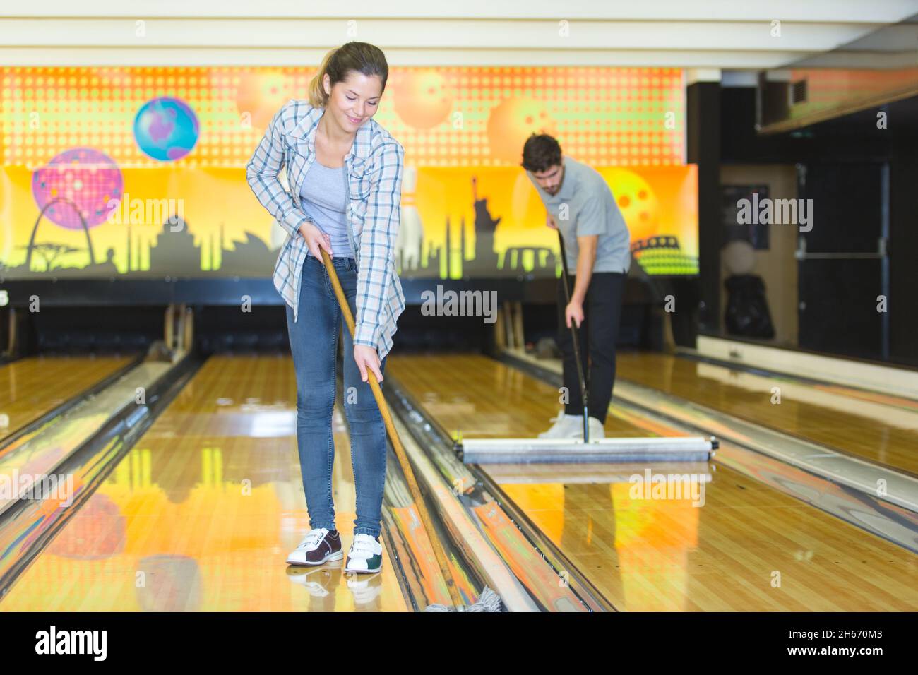 staff cleaning bowling alleys Stock Photo - Alamy