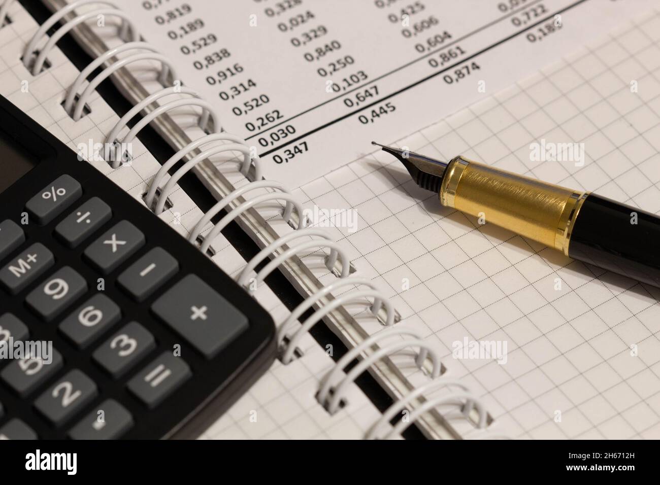 Financial report, pen and paper with numbers on the table in the office ...