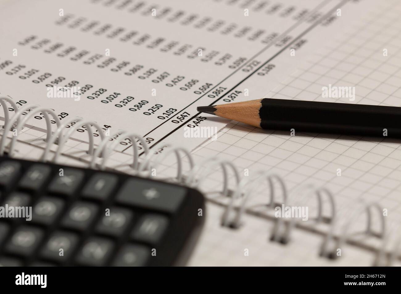 Financial report, pencil and paper with numbers on the table in the ...