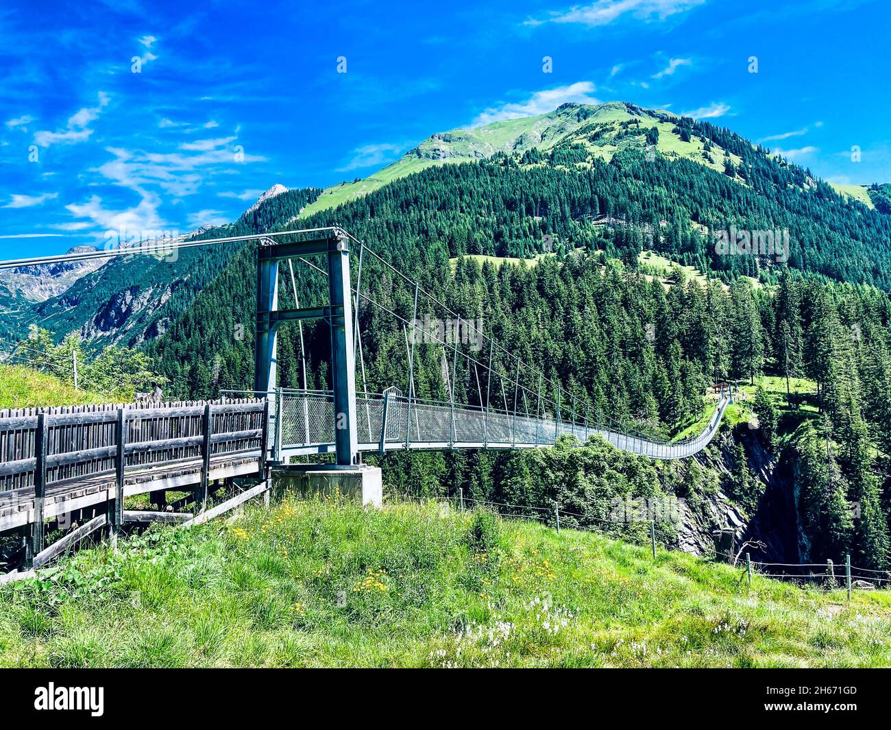 suspension bridge in a mountain landscape in austria Stock Photo - Alamy