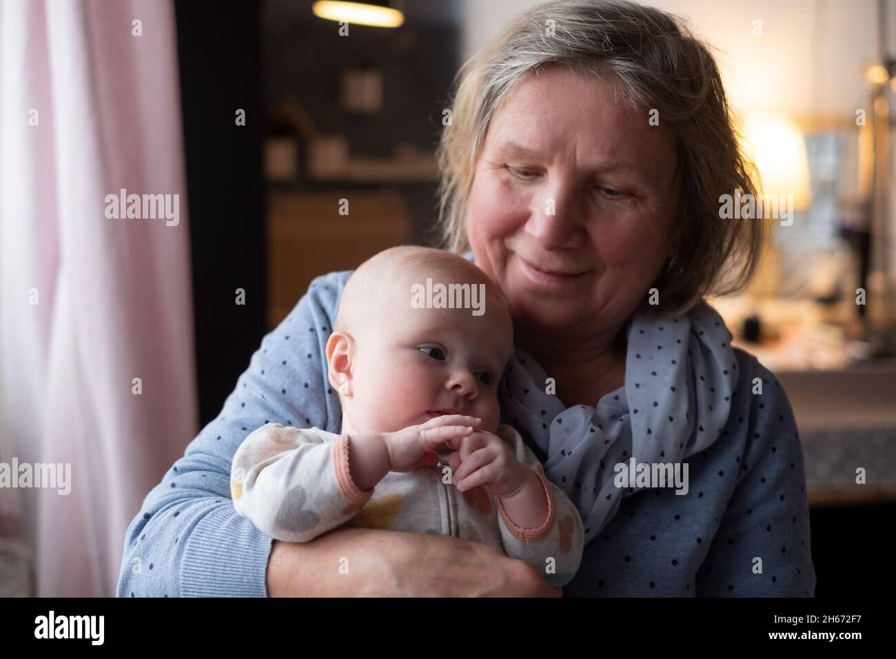 Grandmother holding newborn baby hi-res stock photography and images ...