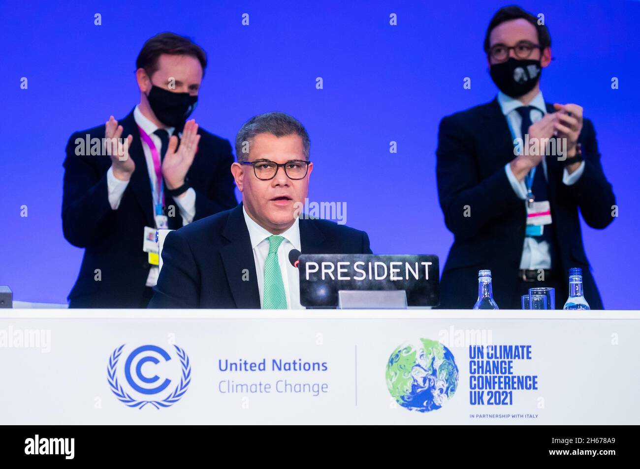 Glasgow, UK. 13th Nov, 2021. Alok Sharma (M), President of COP26, is ...