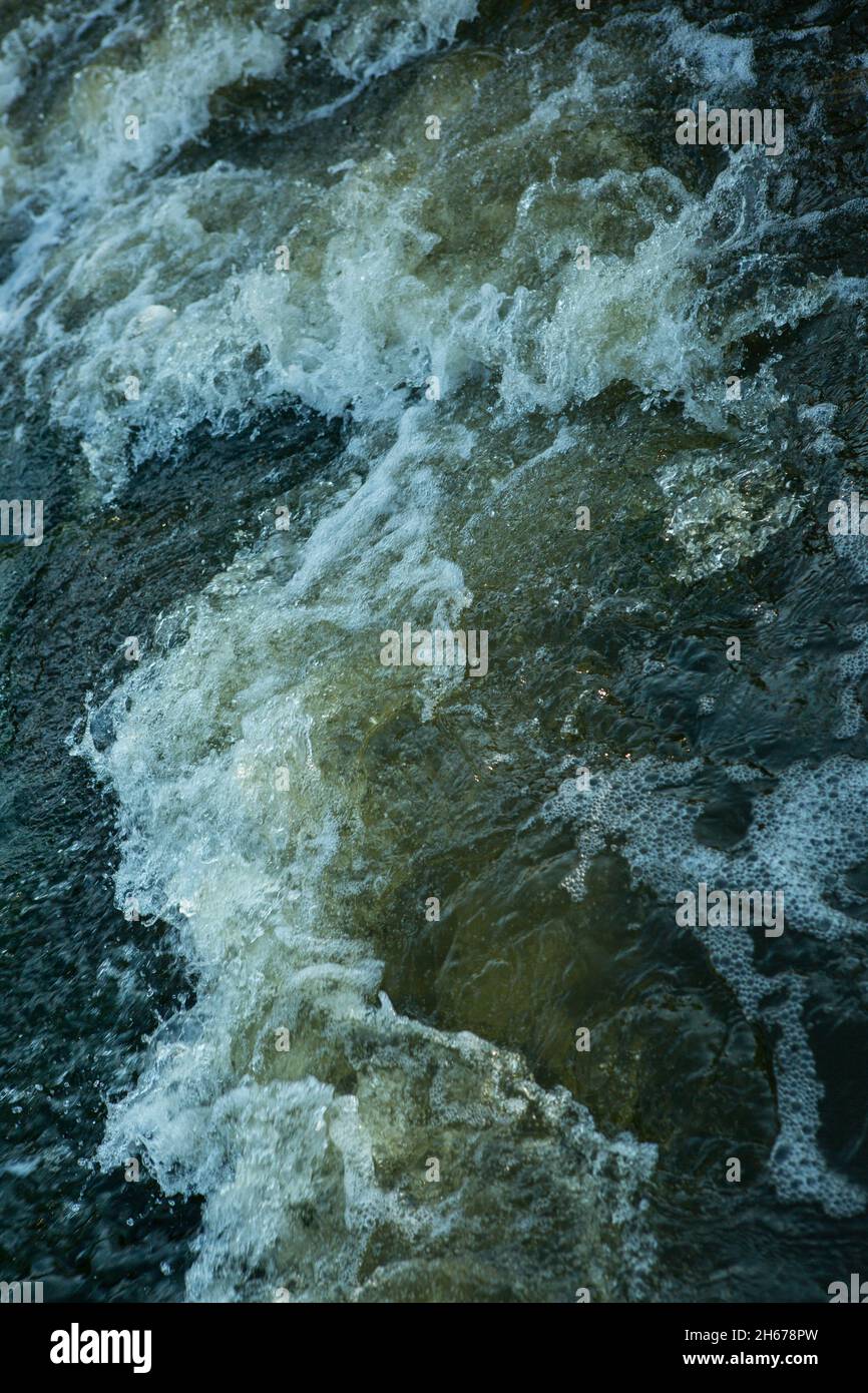Abstract background. Waves of fresh water meet with underwater pointed ...