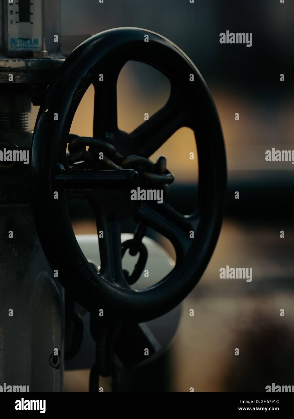 Black control wheel that manipulates an unknown mechanism Stock Photo ...