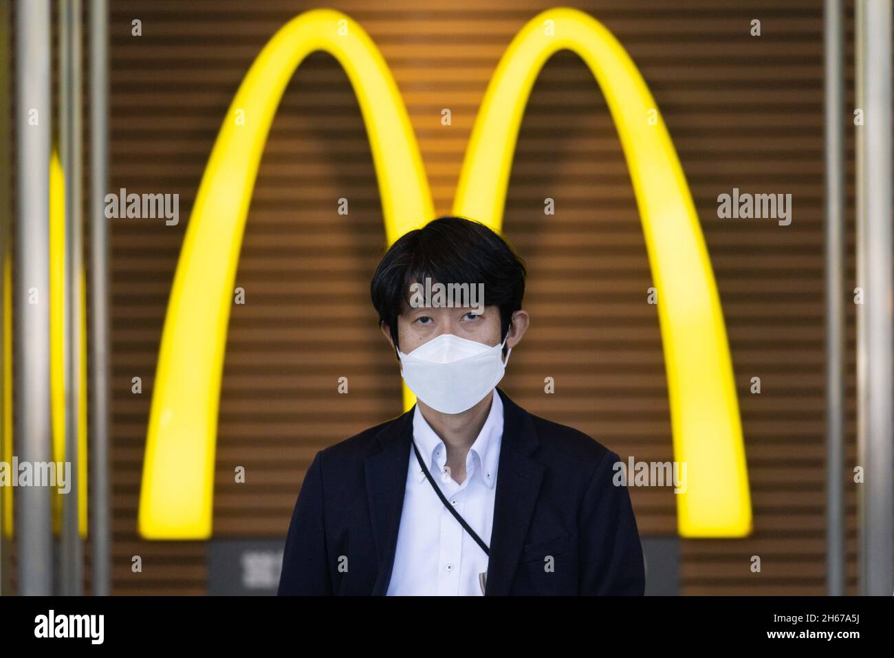 Man is seen wearing a face mask with the background of a McDonald's ...
