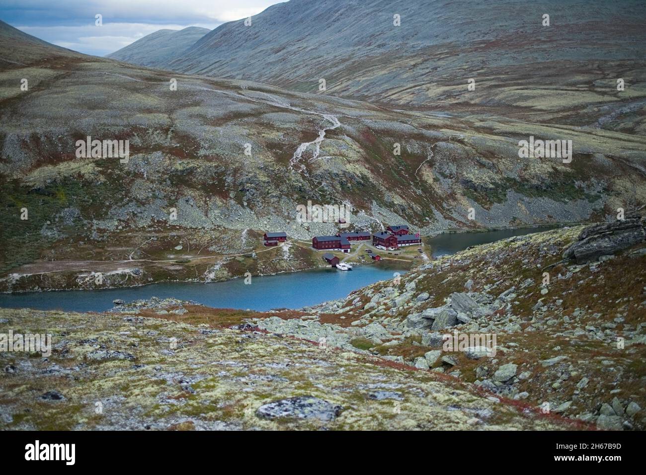 Rondvatnet lake and several red buildings at the Rondane national park ...