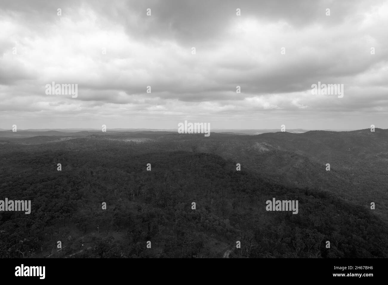 High aerial drone view of distant mountain ranges in monotone Stock ...