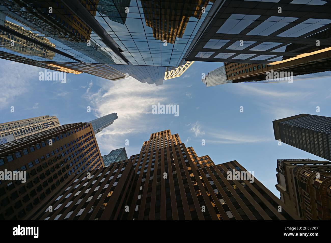 Upward view of skyscrapers in New York City, New York against early ...
