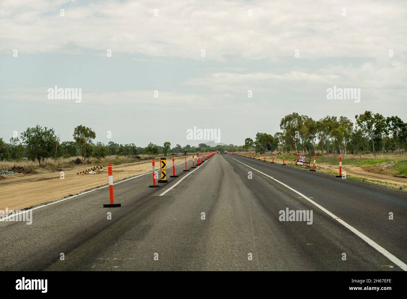 A long straight road with construction work duplicating the highway on ...