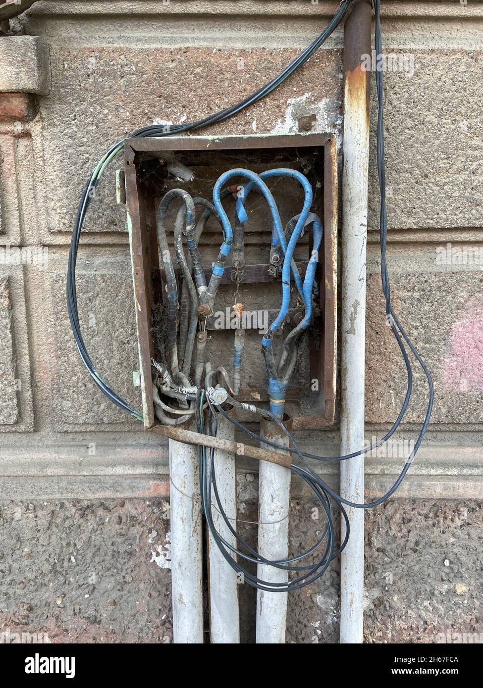 Outdoor outdoor electrical switchboard with wires protruding outward ...