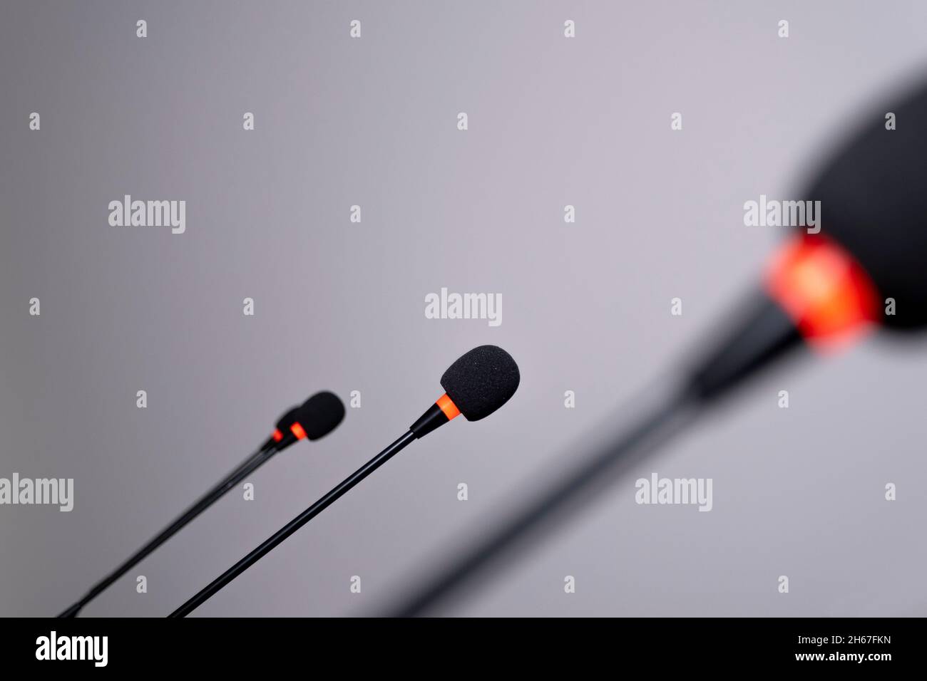 Small microphones for the presenter on the background of the screen for ...
