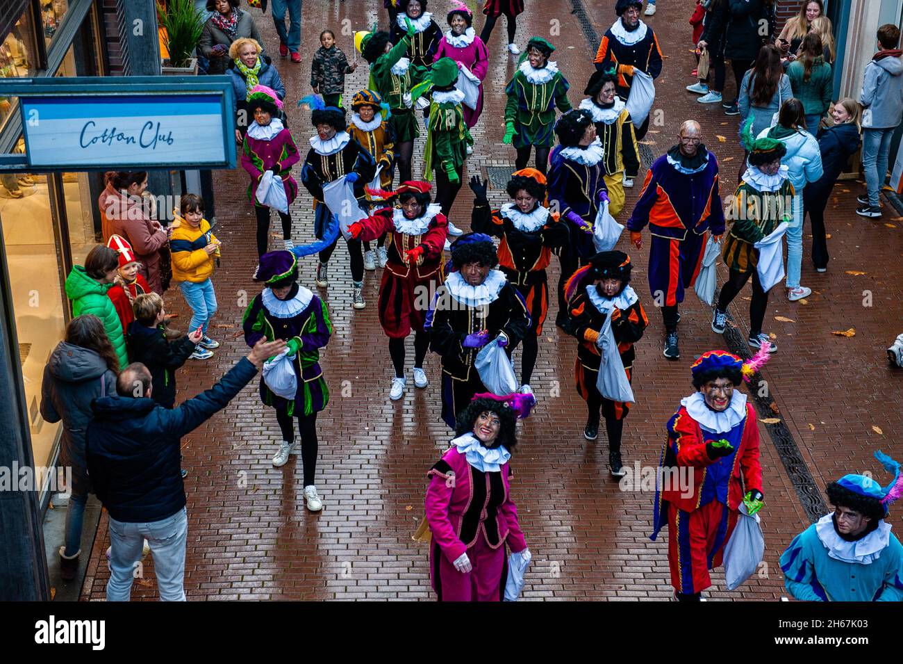 Families are seen watching the St. Nicholas helpers arriving at the ...