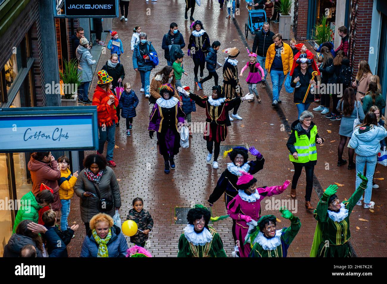 A group of St. Nicholas helpers seen dancing on the street.The first ...