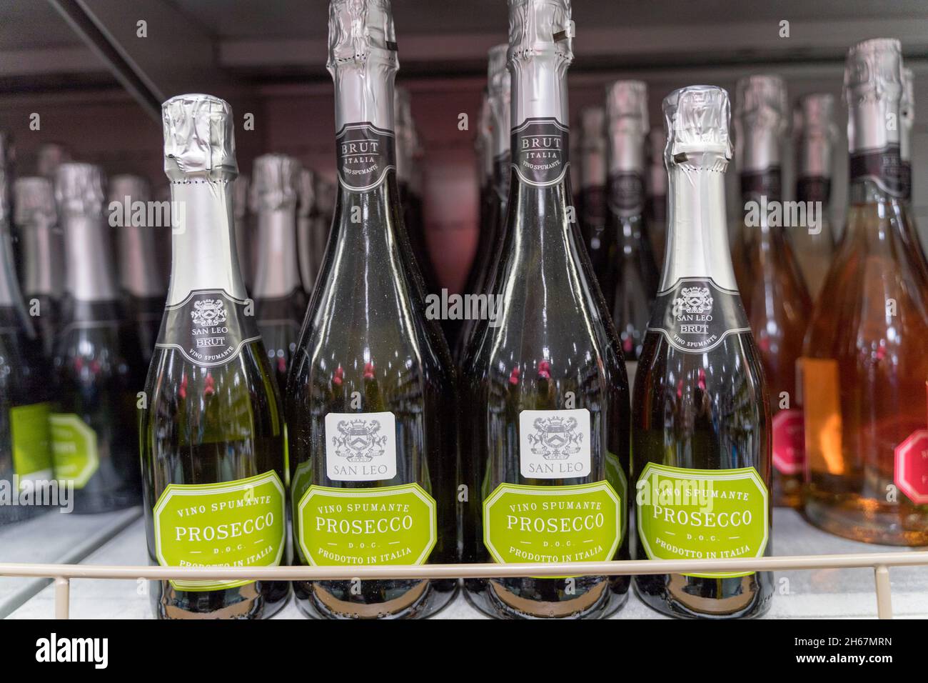 rows of Prosecco . vino Spumante on wine cabinet England UK Stock Photo ...