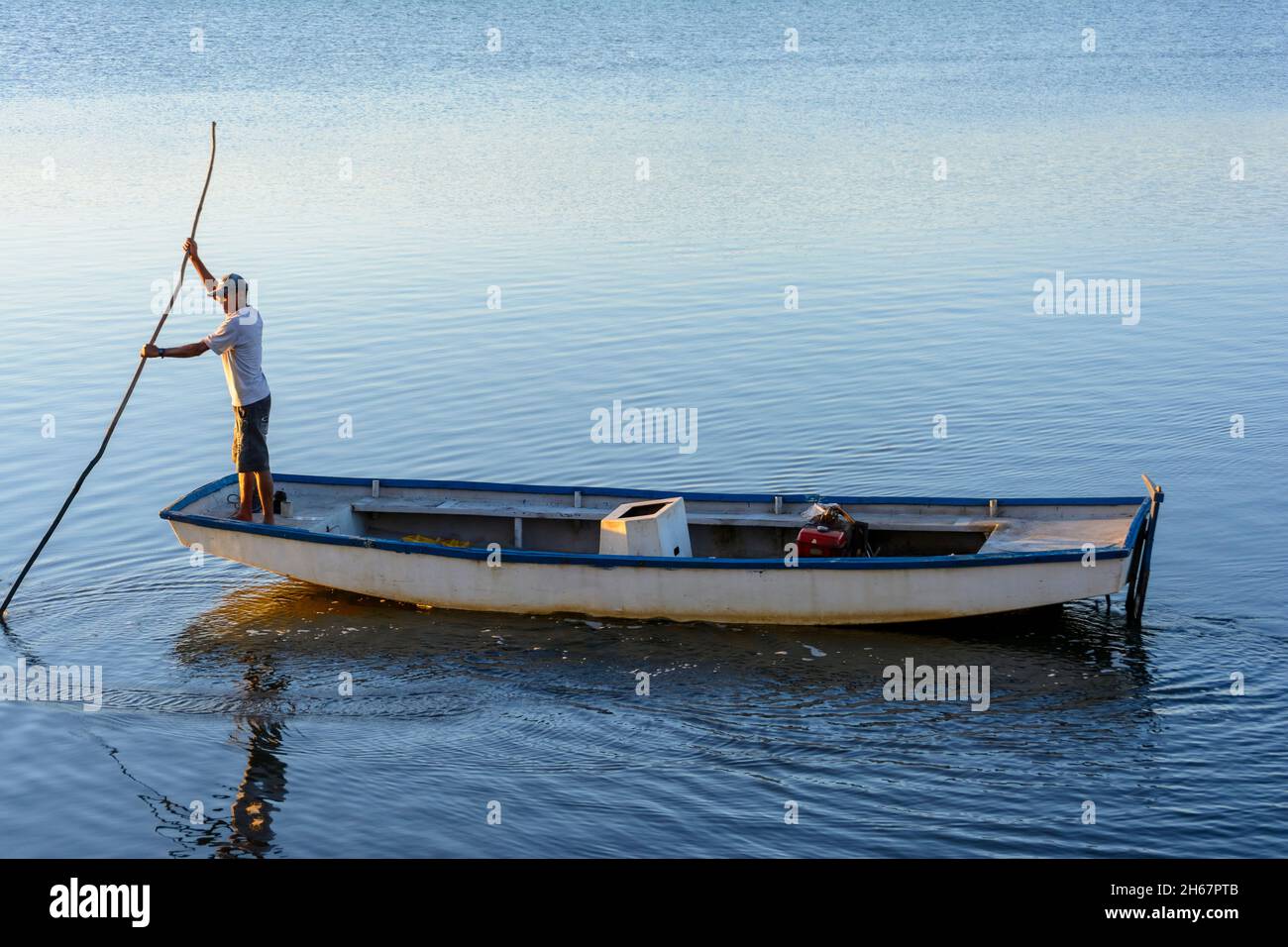 Fisherman sailing with his canoe on the grand Paraguacu river, located ...