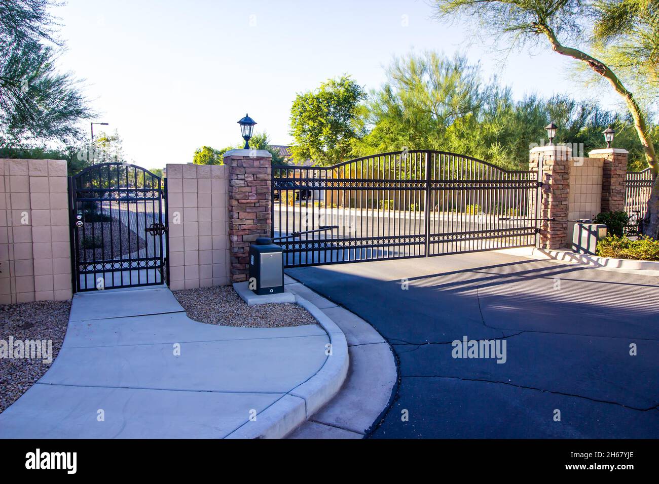Pedestrian And Auto Exit Metal Gate Stock Photo - Alamy