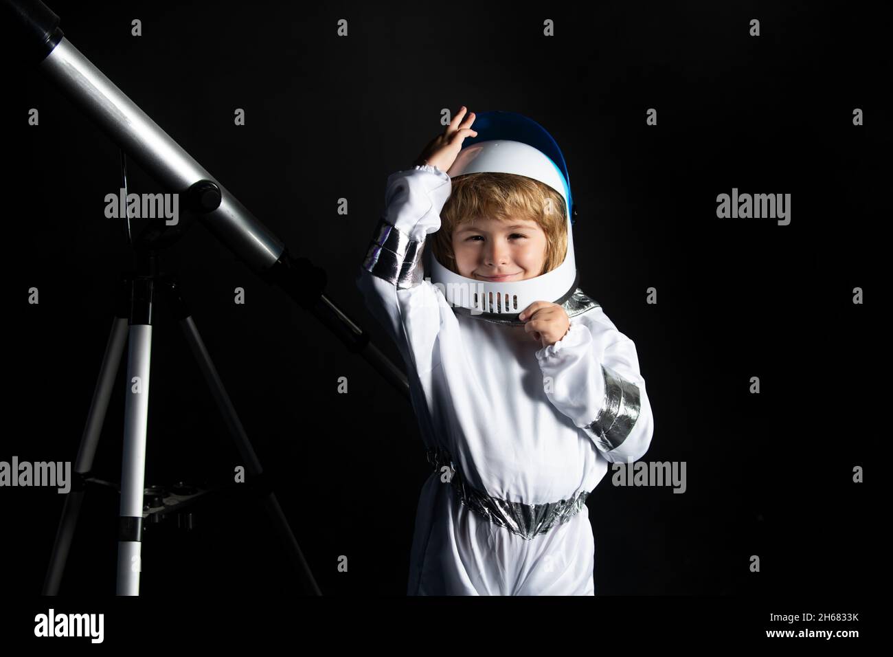 Adorable cute boy astronaut in outer space. Child imagines himself to ...