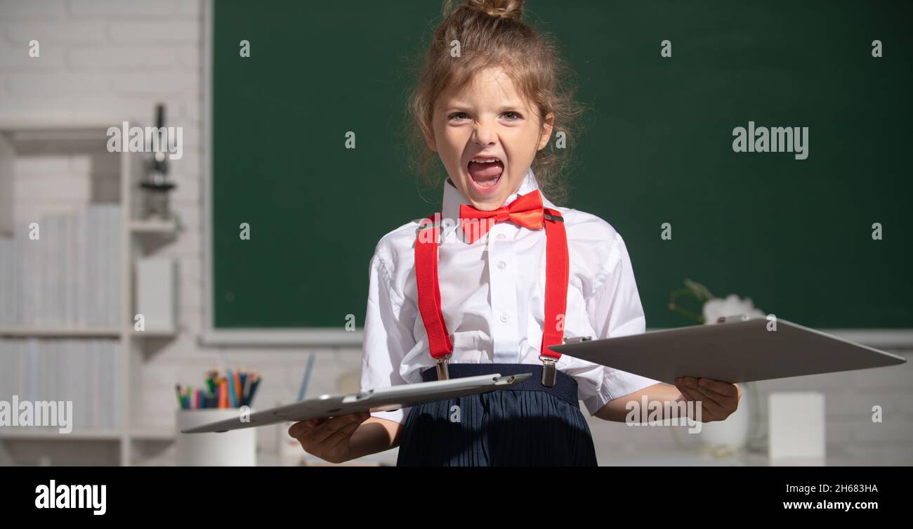 Bad child girl pupil in opposition distance education. Angry kid broken ...