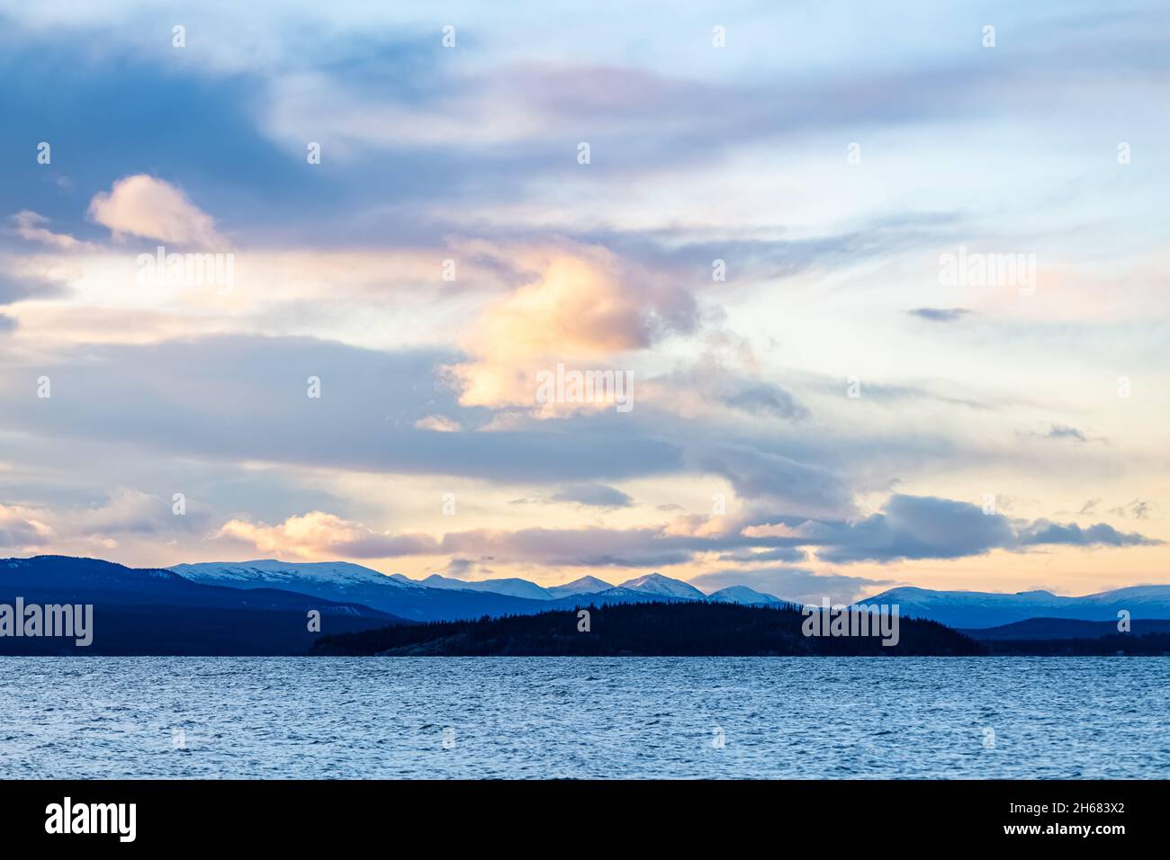 Stunning landscape sunset above mountains in wilderness of Yukon ...