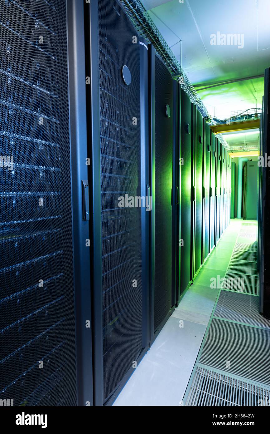 Data center with multiple rows of fully operational server racks Stock Photo - Alamy