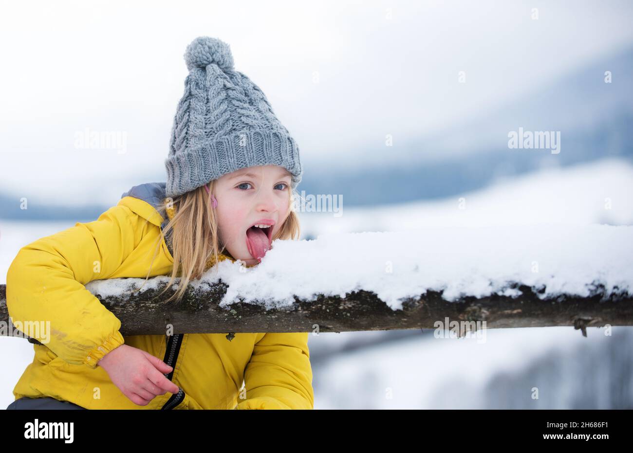 Girl eating snow hi-res stock photography and images - Alamy