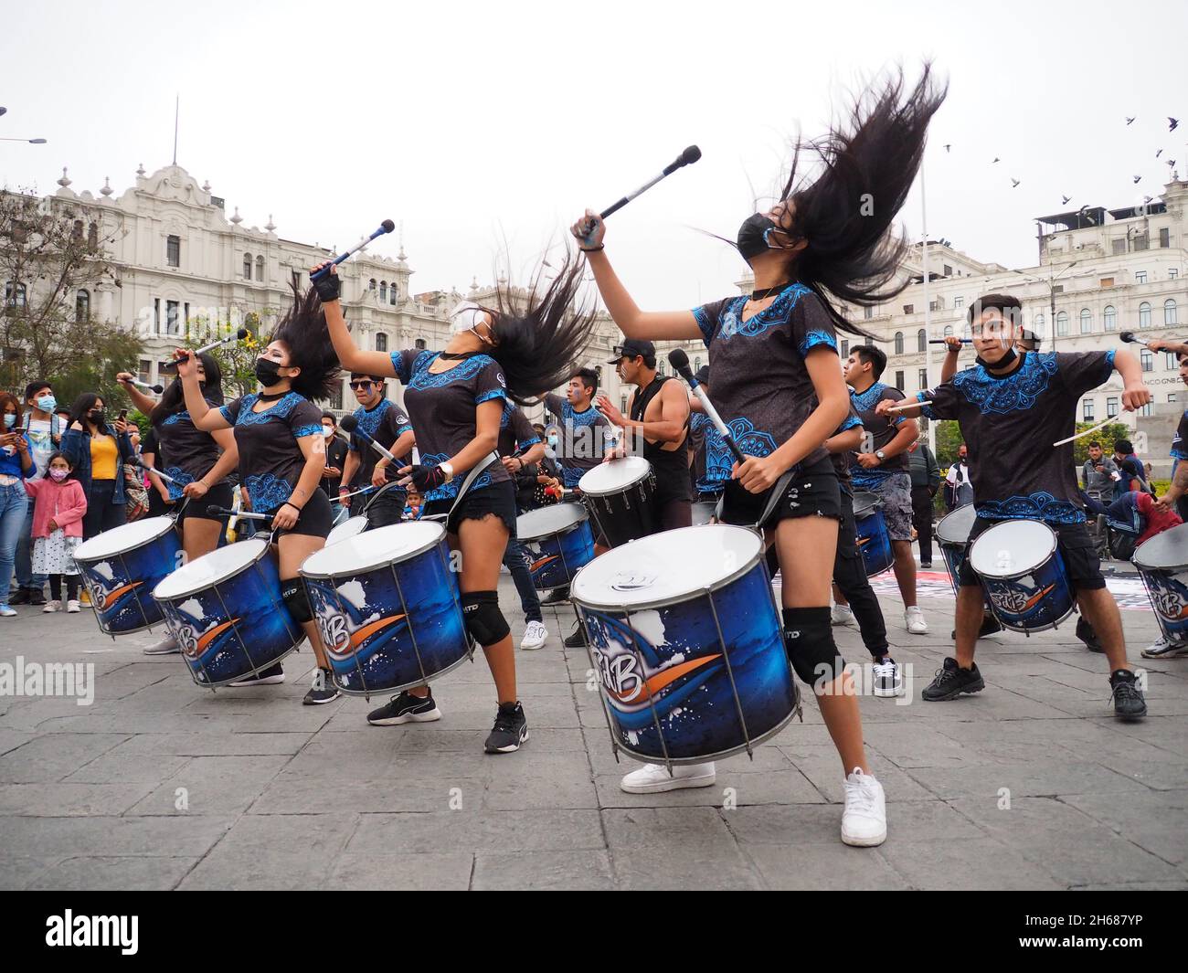 A girl band beating the drum when hundreds of demonstrators took to the ...