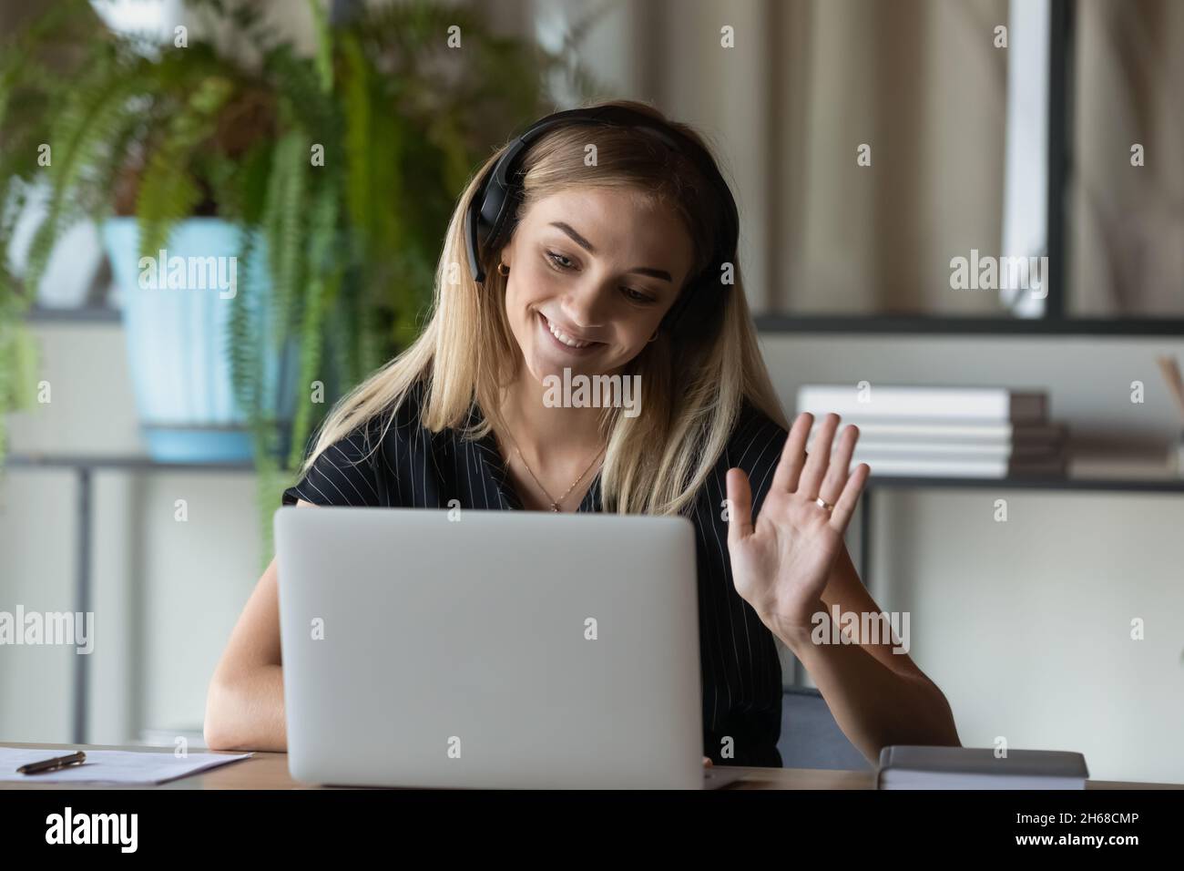 Female teacher holding video call hi-res stock photography and images ...