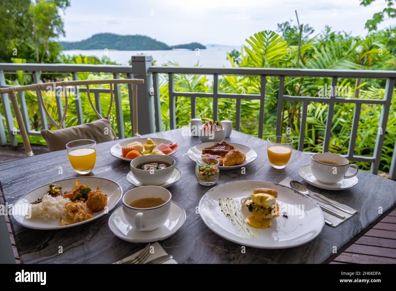 Breakfast table looking out over the ocean, breakfast with coffee bread ...