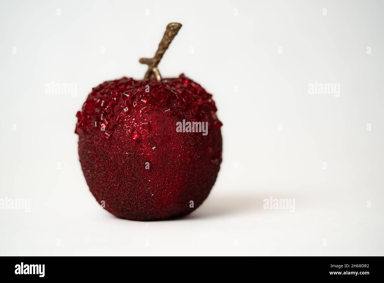 artificial red apple with shiny stones on a white background Stock ...