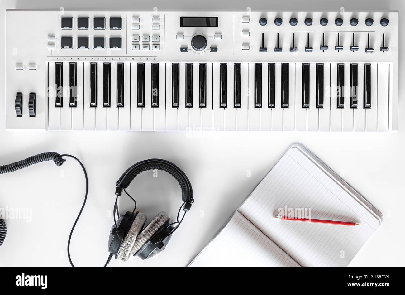 Musical flat lay background with headphones musical keys Stock Photo ...