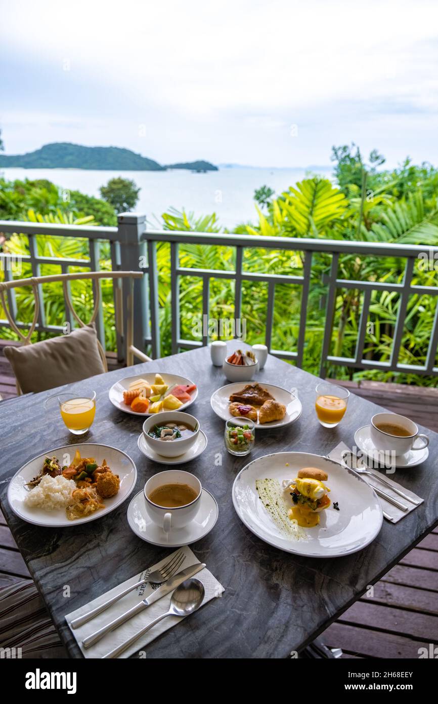 Breakfast food over landscape background hi-res stock photography and ...