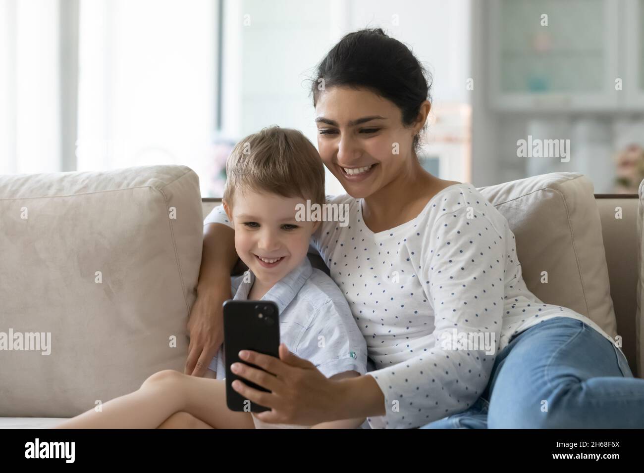 Happy mom and son making video call on smartphone Stock Photo - Alamy