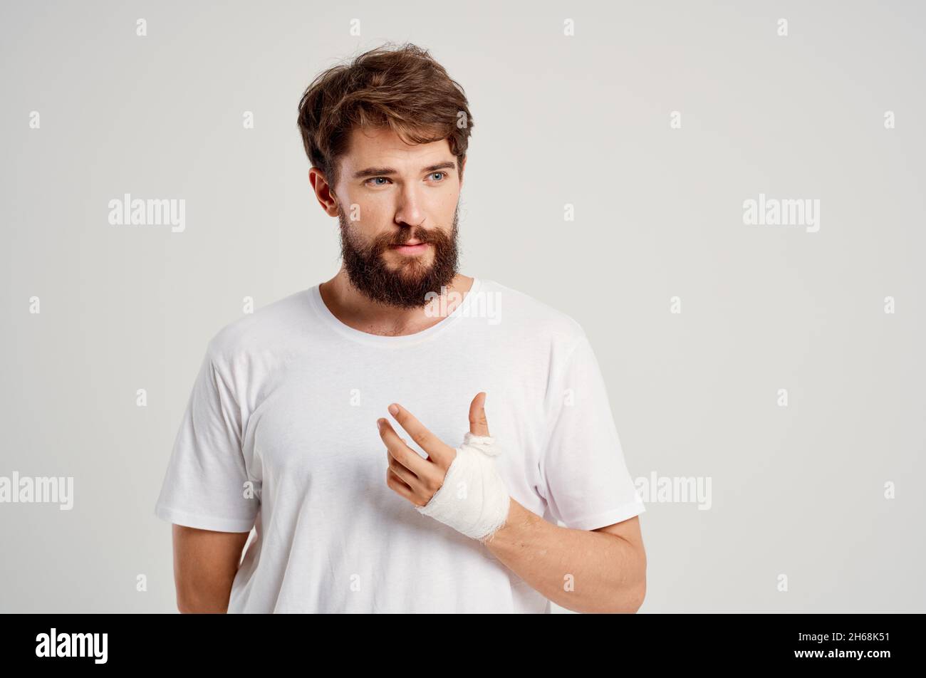 bearded man bandaged hand injury to fingers hospitalization hospital ...